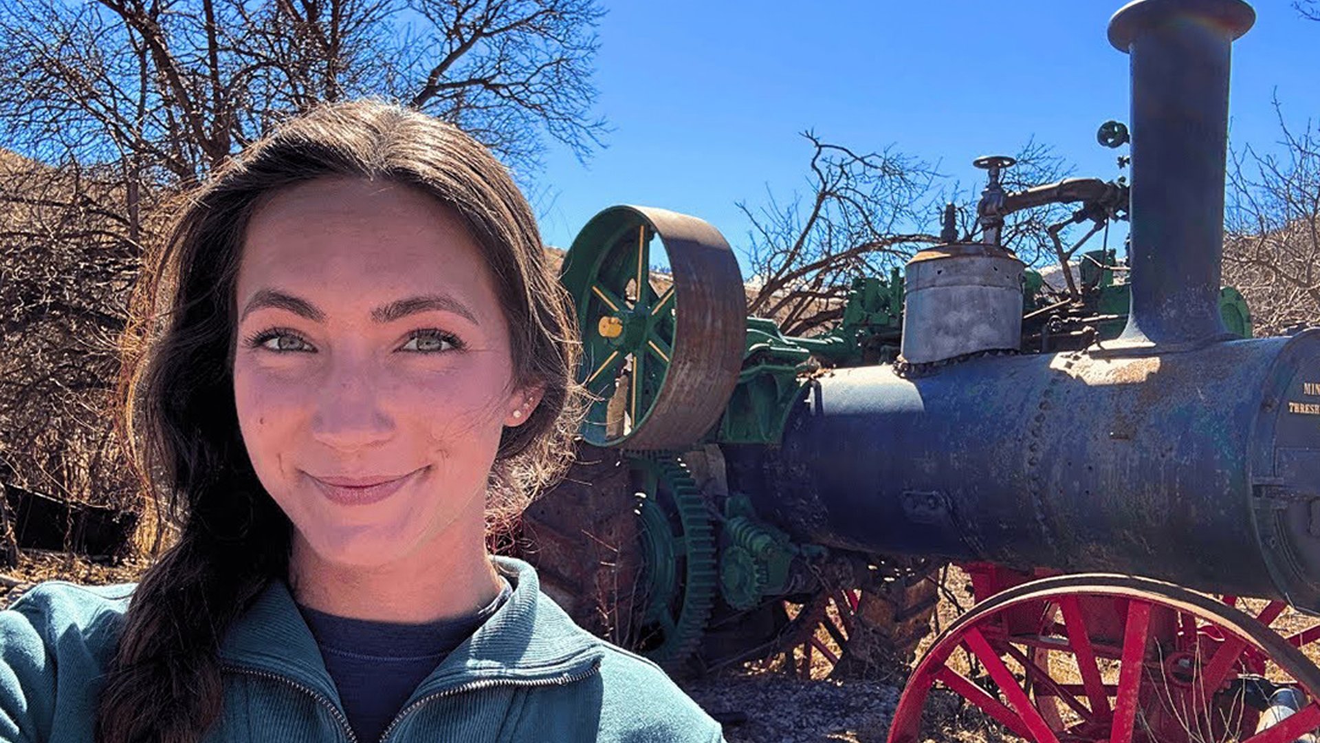 Inspecting an old farm tractor