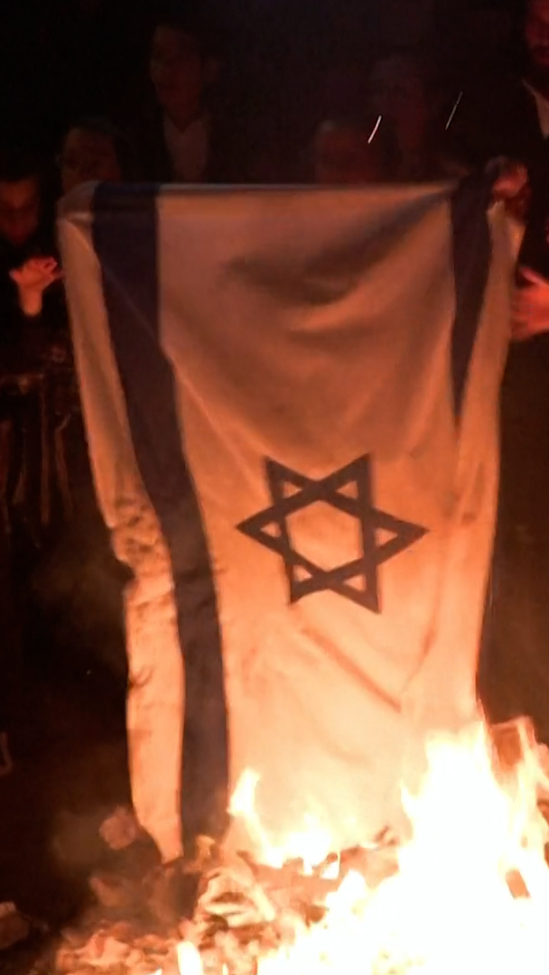 Ultra-Orthodox Jews burn Israeli flags to protest national day