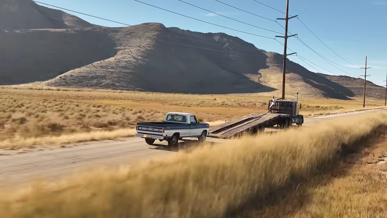 He tried to drive onto a moving trailer… it went exactly as you’d expect