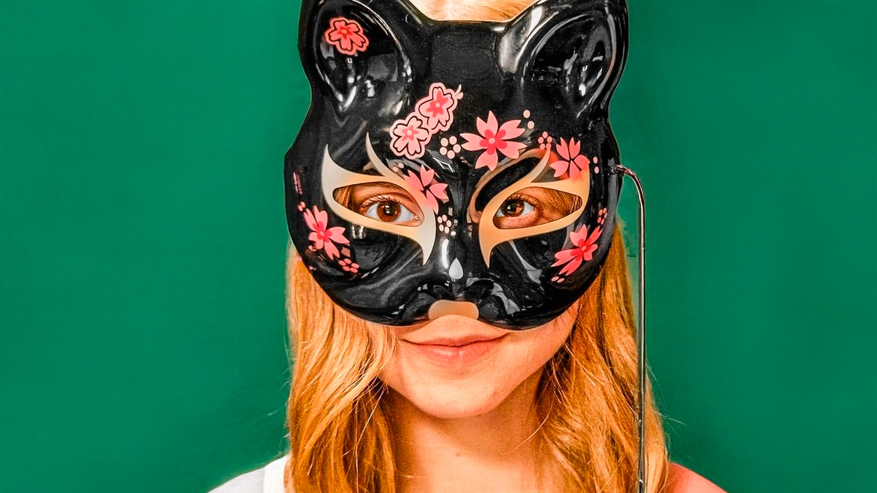 Cheerleader hides her face under a mask?