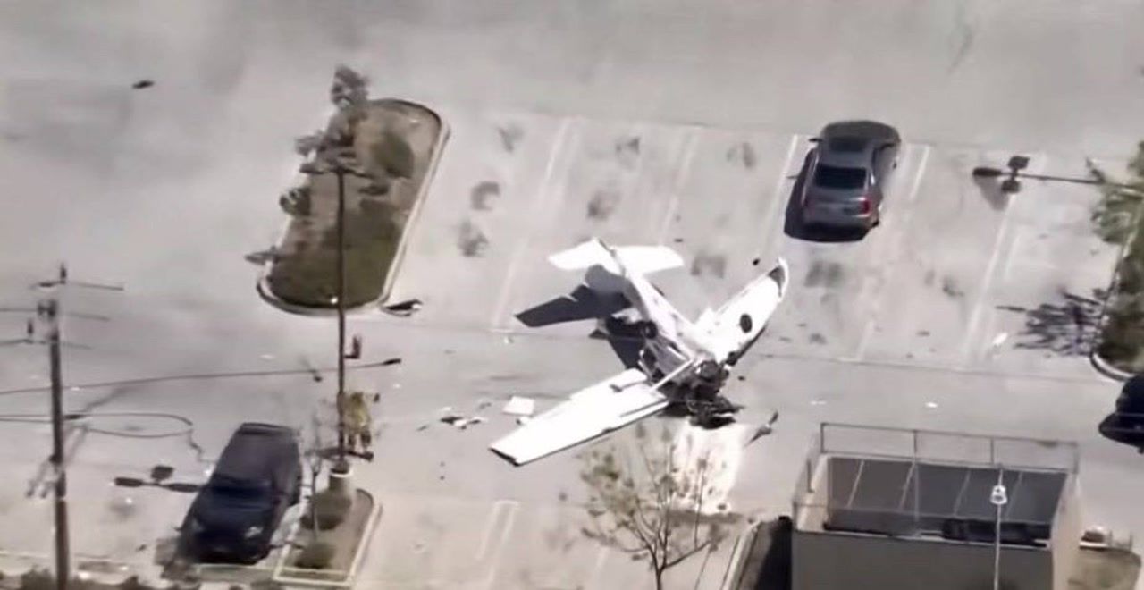 Plane hits power lines, crashes into Los Angeles parking lot; pilot ...