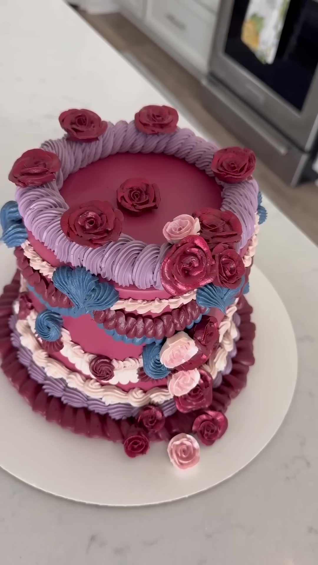 Custom cake decorated with rich jewel-toned colors throughout