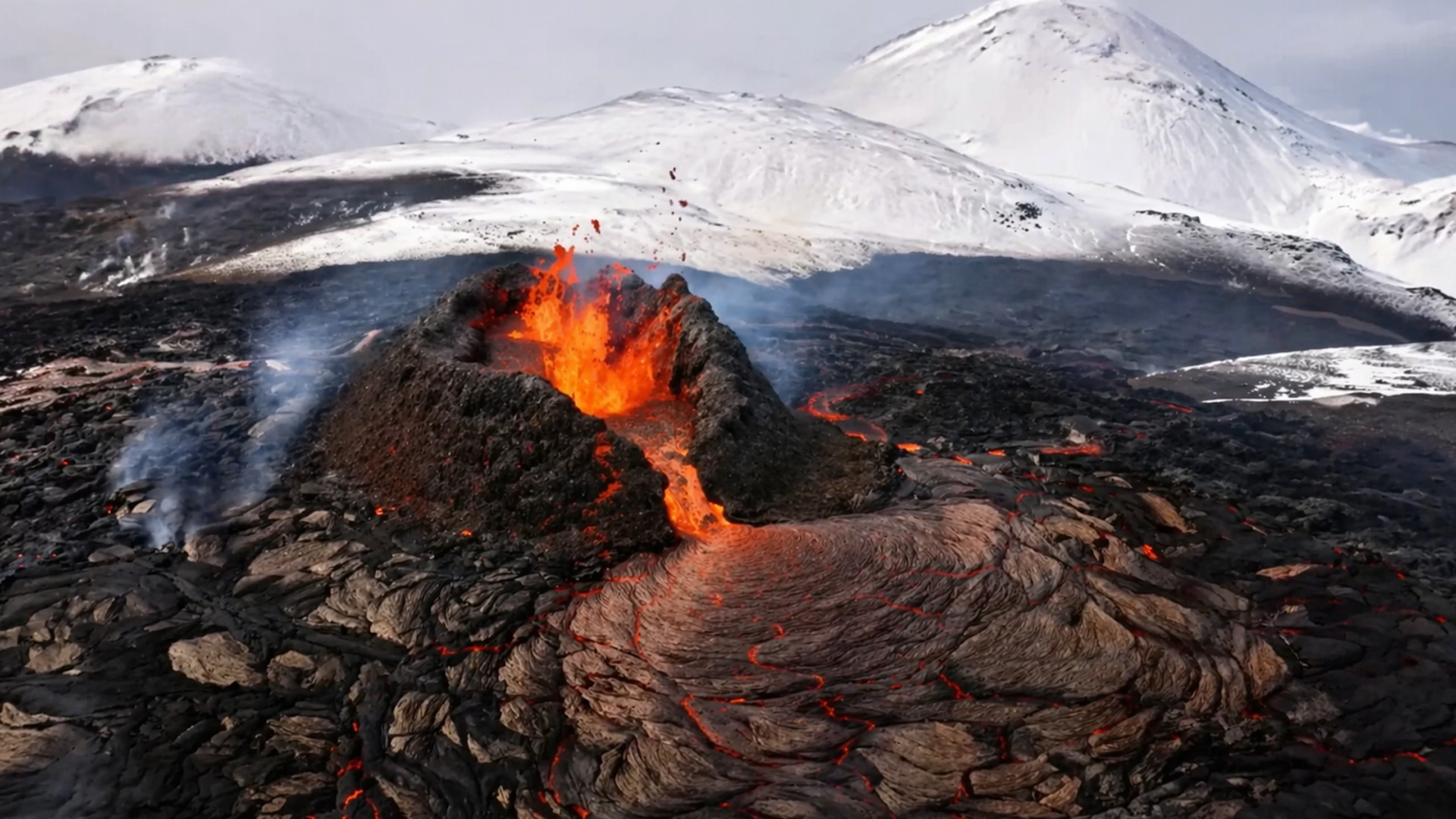 Hot lava surrounded by snowy peaks