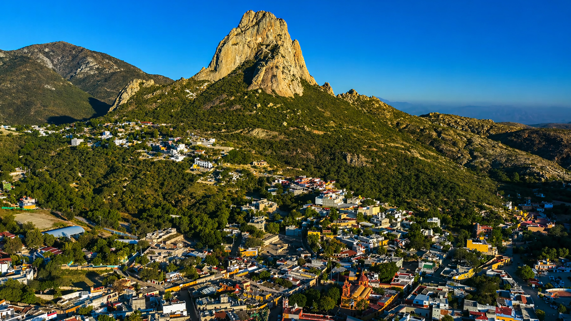 Colorful town at the foot of a majestic mountain peak