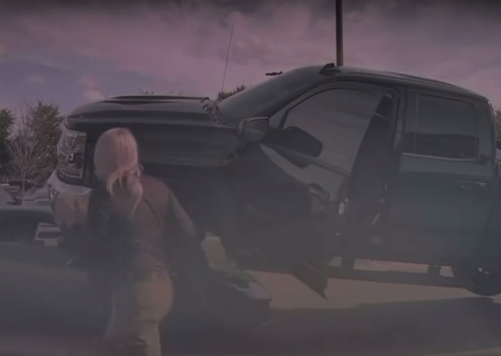 Petite blonde lady behind wheel of lifted Silverado drives over ...