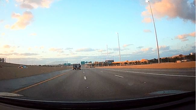 Mattress flying off trailer nearly smacks car on Florida Turnpike