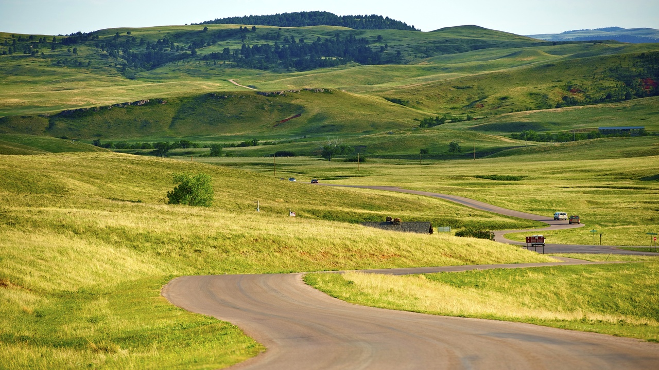 Where else can you drive past bison, duck into caves and stare up at ...