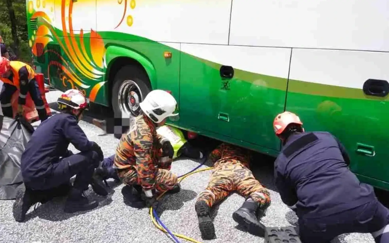 Teen motorcyclist dies after being trapped under bus