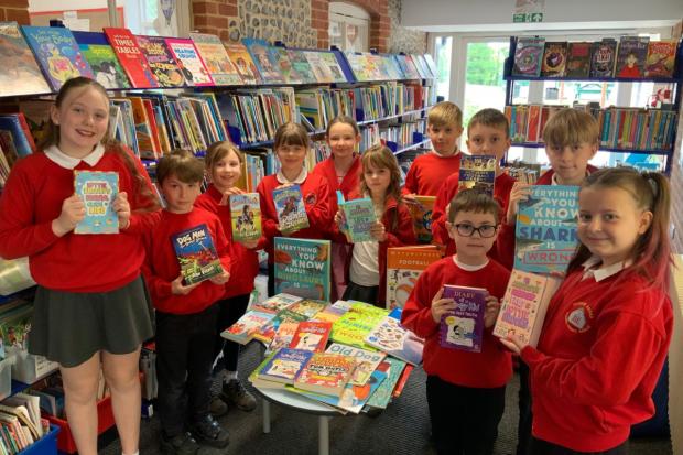 Primary school celebrates generous donation of 50 new books