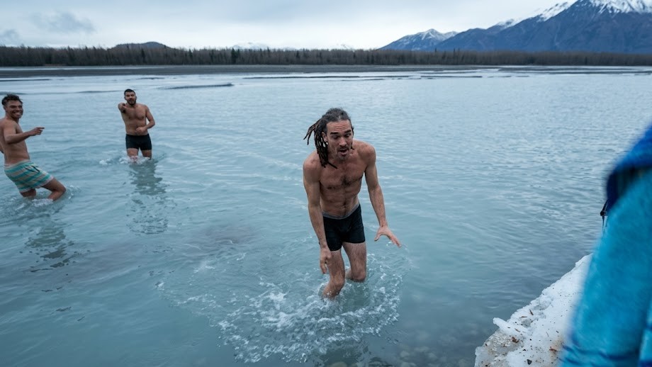 They jumped into a frozen lake in Alaska - 32°F water hit like a wall