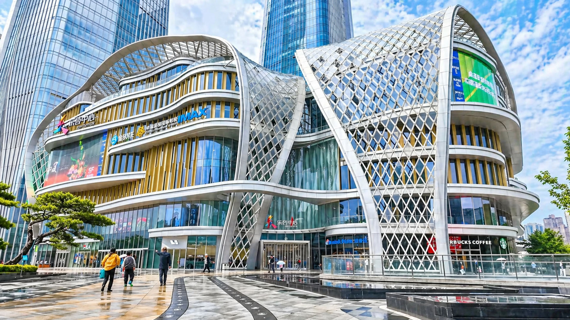 This futuristic mall features a massive glass waterfall inside building