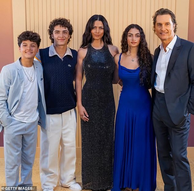 Matthew McConaughey, 56, is seen in a rare photo with his mini-me children