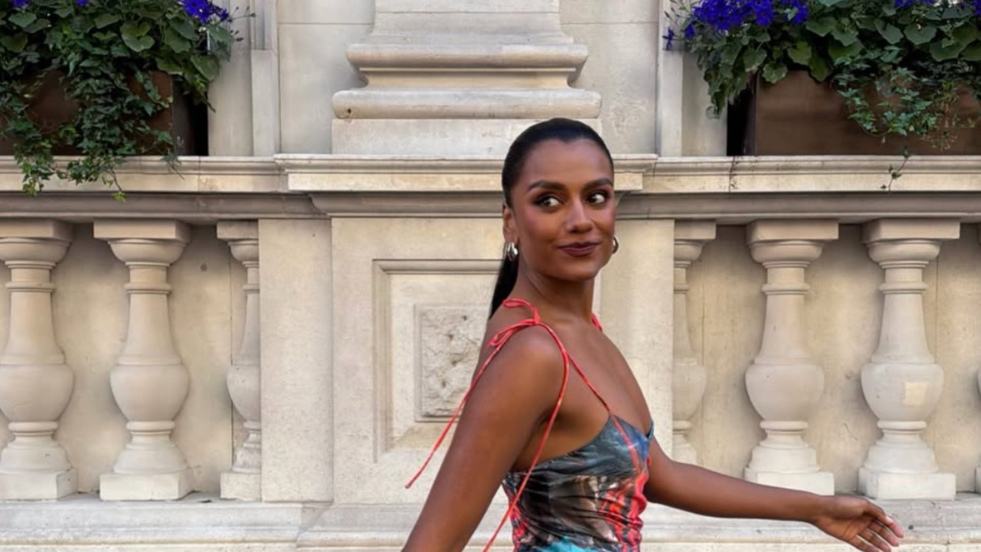Simone Ashley, in her beach outfit, causes a stir on the sand