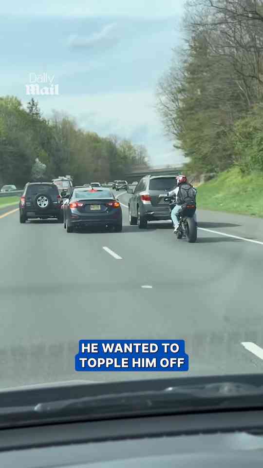 Driver and motorcyclist argue during highway confrontation