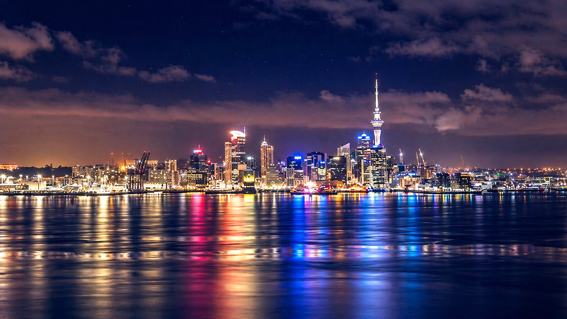 Auckland’s skyline lit up around the iconic Sky Tower