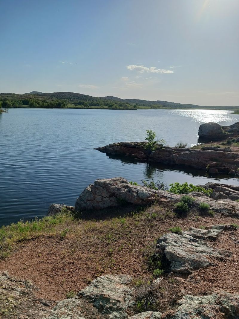 This Oklahoma dam stands tall over a quiet lake with views that feel ...