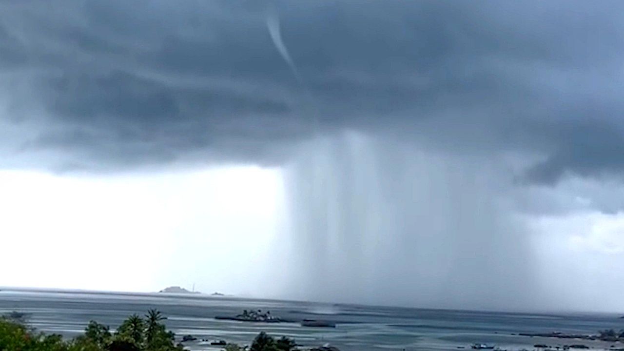 Massive funnel forms offshore as storm churns near coastline