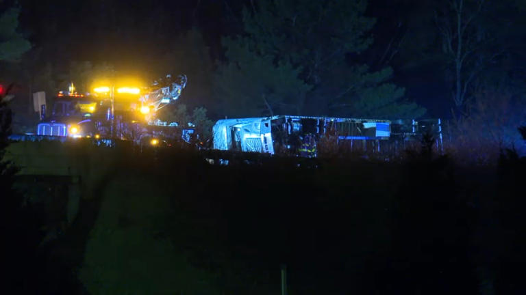 Tractor-trailer rolls over on Mass. Pike in Weston