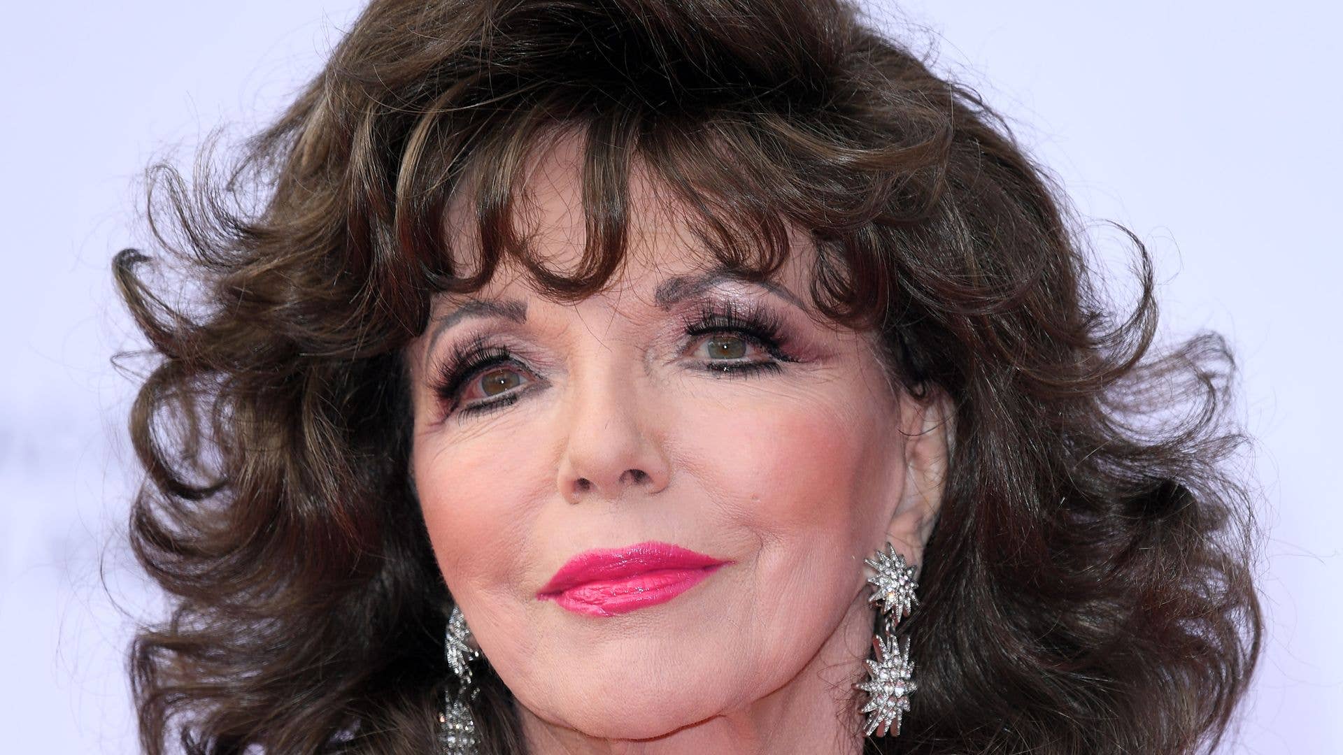 Joan Collins looks fabulous at 92 in Barbie pink suit amid exciting M&S ...