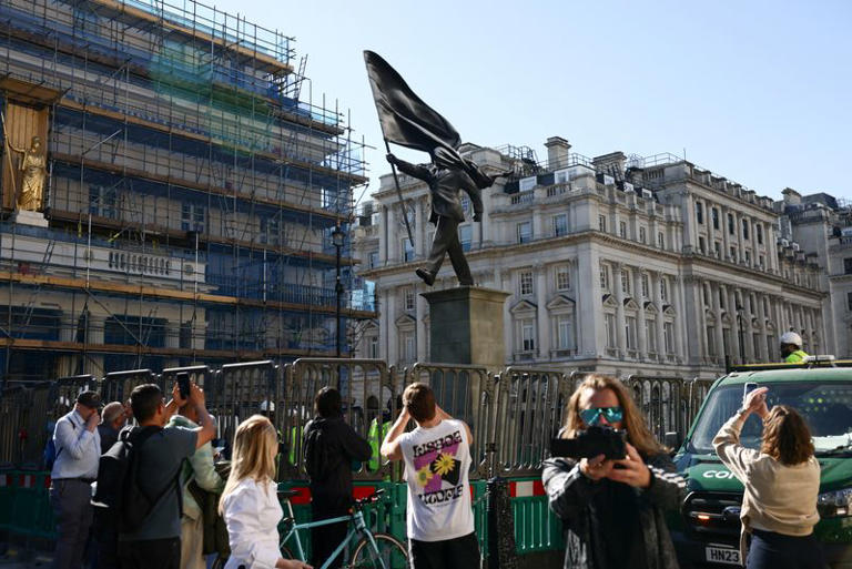 London hails new Banksy statue of man blinded by flag