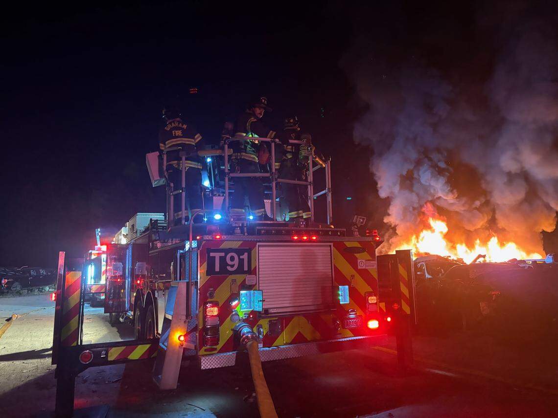 Firefighters battle flames, explosions at Pierce County auto wrecking yard