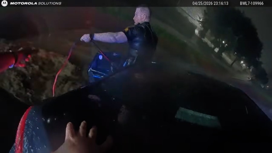 Watch: Police save mother, 3 children after car becomes stranded in ...