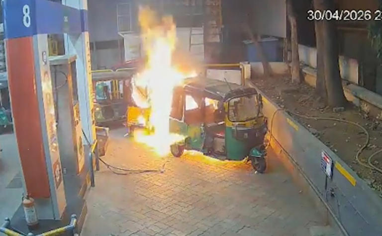 Workers and motorists flee as two auto rickshaws catch fire at petrol ...