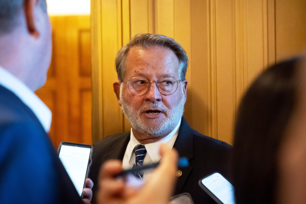 Michigan’s outgoing senator warns Democrats against ugly succession race