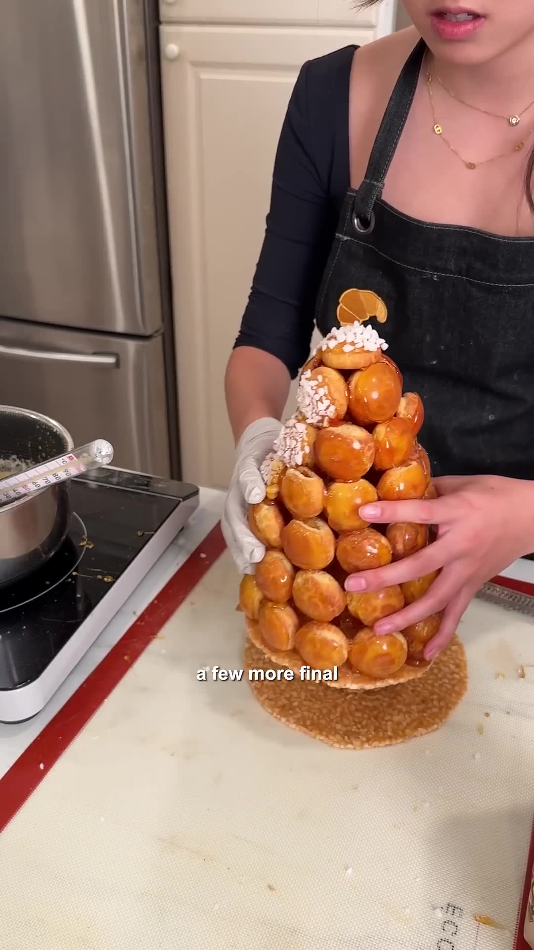 Part four of the elaborate croquembouche assembly process