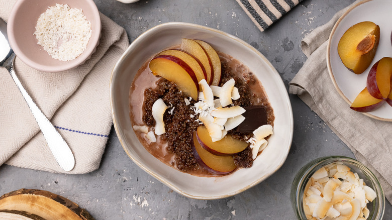 Breakfast quinoa bowl with plums and dark chocolate recipe