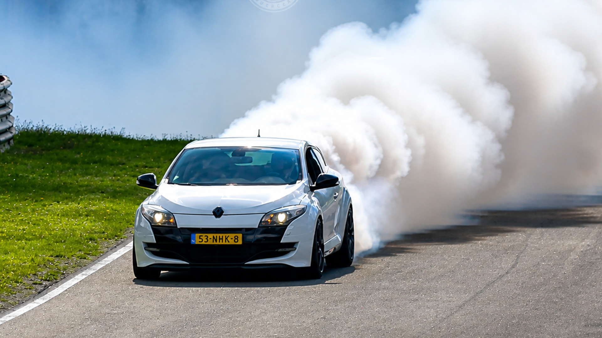 The engine blows and covers the entire track in massive smoke