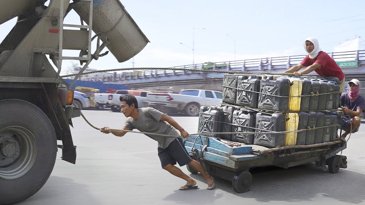 Dangerous Filipino technique to power engineless wooden cart on highway
