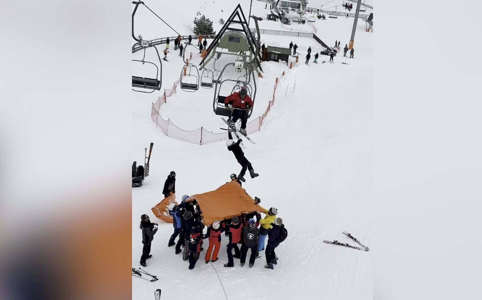 Skiers rescue child dangling from chairlift using makeshift cushion