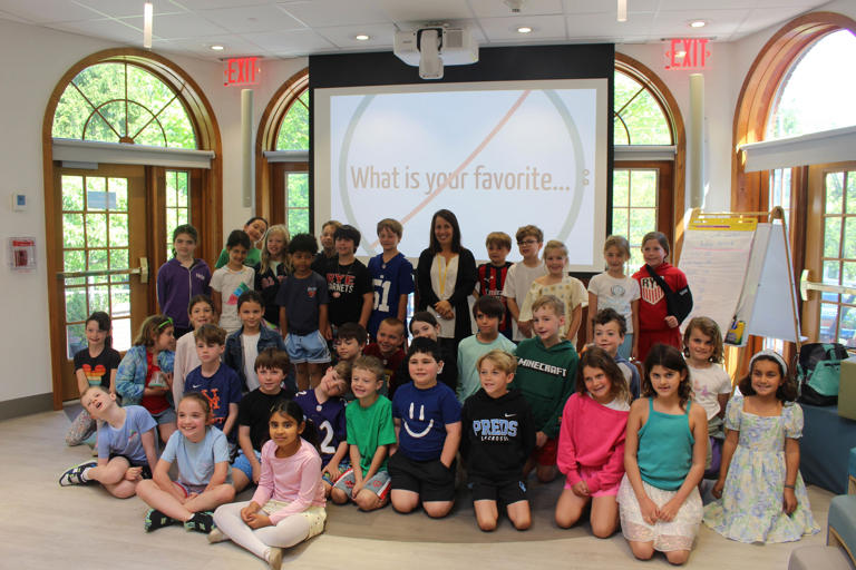 Author inspires second graders to create story ideas of their own