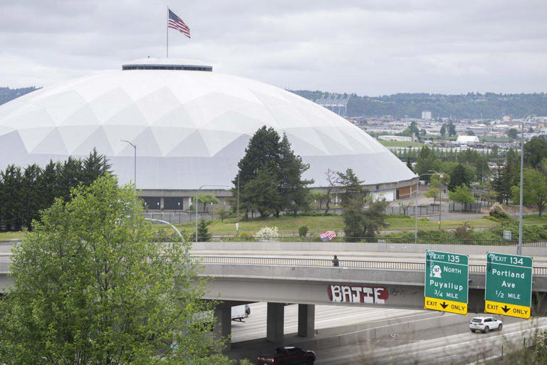 Who is that man waving an upside-down American flag near the Tacoma ...