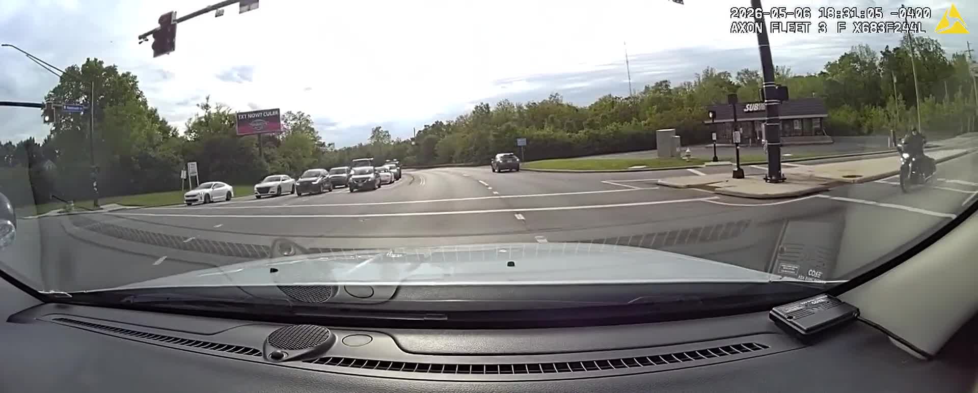 Police cruiser hit by motorcycle while responding to call