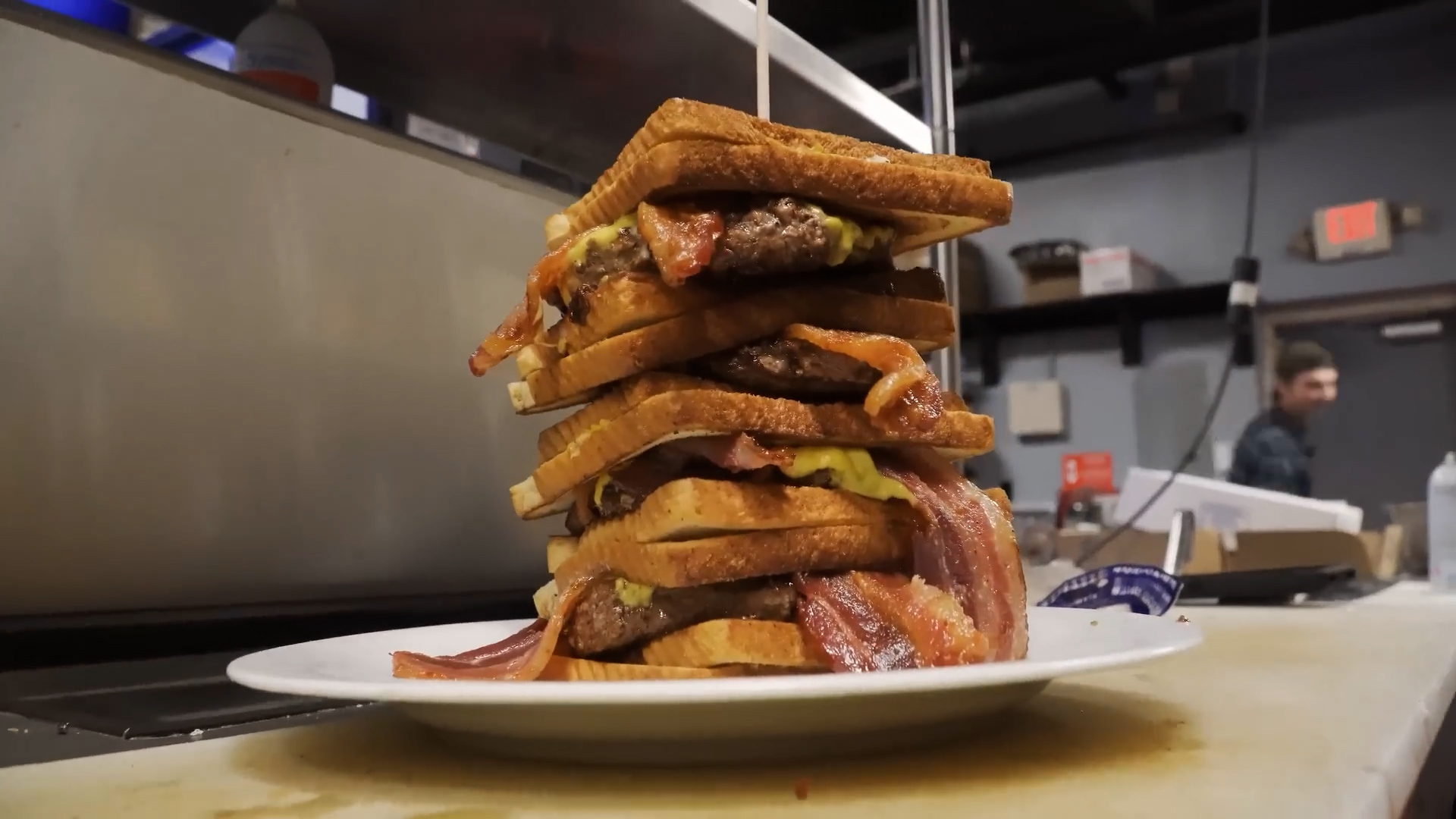 Two men take on burger challenge with grilled cheese sandwiches as buns ...