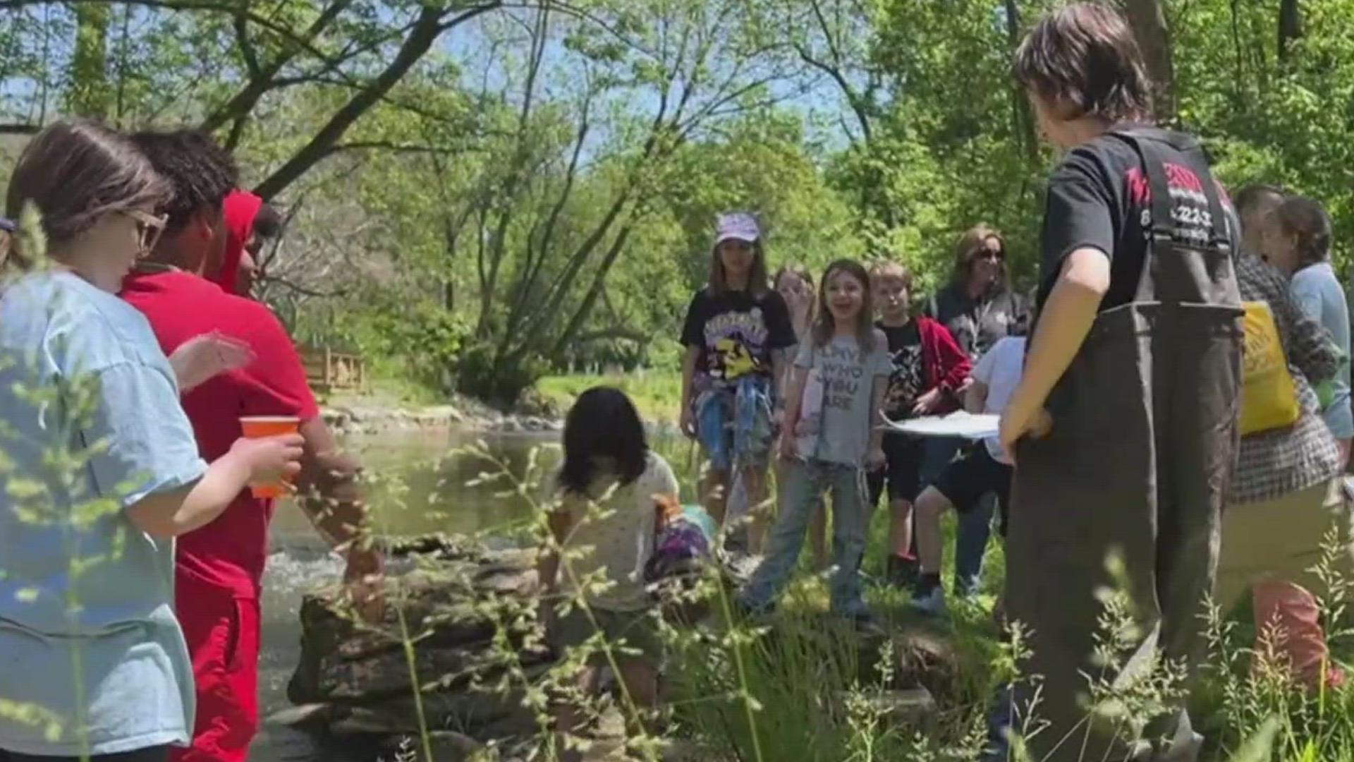 Lancaster students participate in trout release in creek