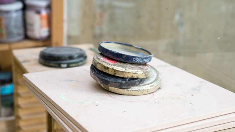 Save old jar lids to craft one-of-a-kind kitchen decor