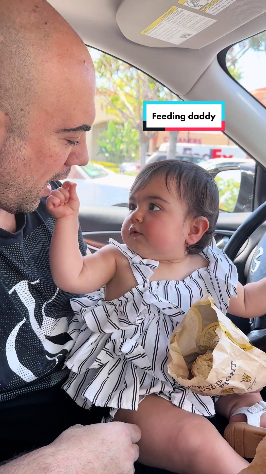Adorable baby feeding dad creates a precious family memory