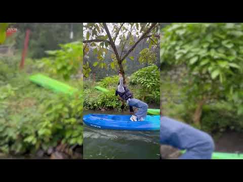 Man loses balance on kayak and falls into water
