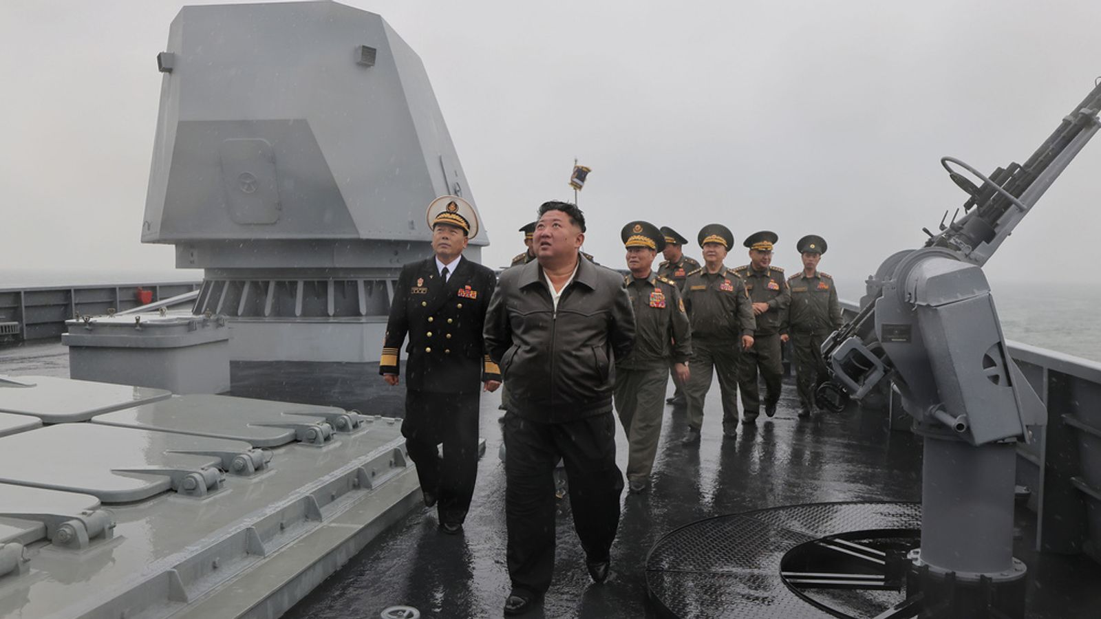 North Korea's Kim Jong Un and daughter eat with crew on new warship