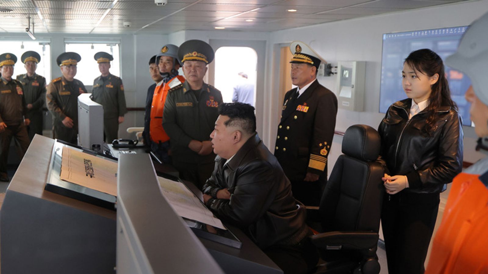 North Korea's Kim Jong Un and daughter eat with crew on new warship