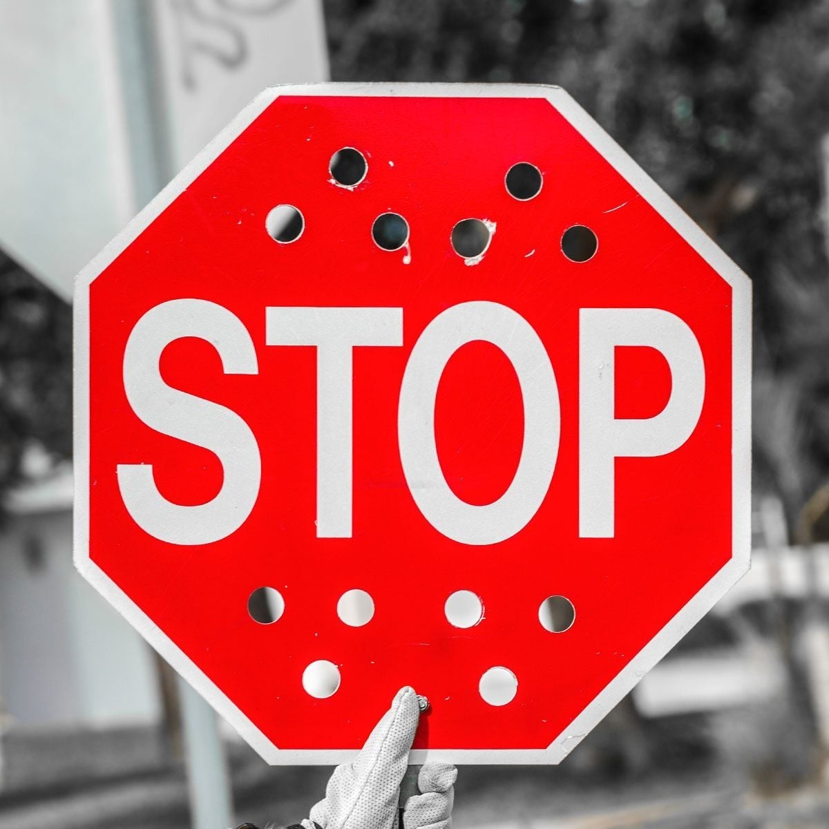 Why some stop signs have small holes — and what drivers should know