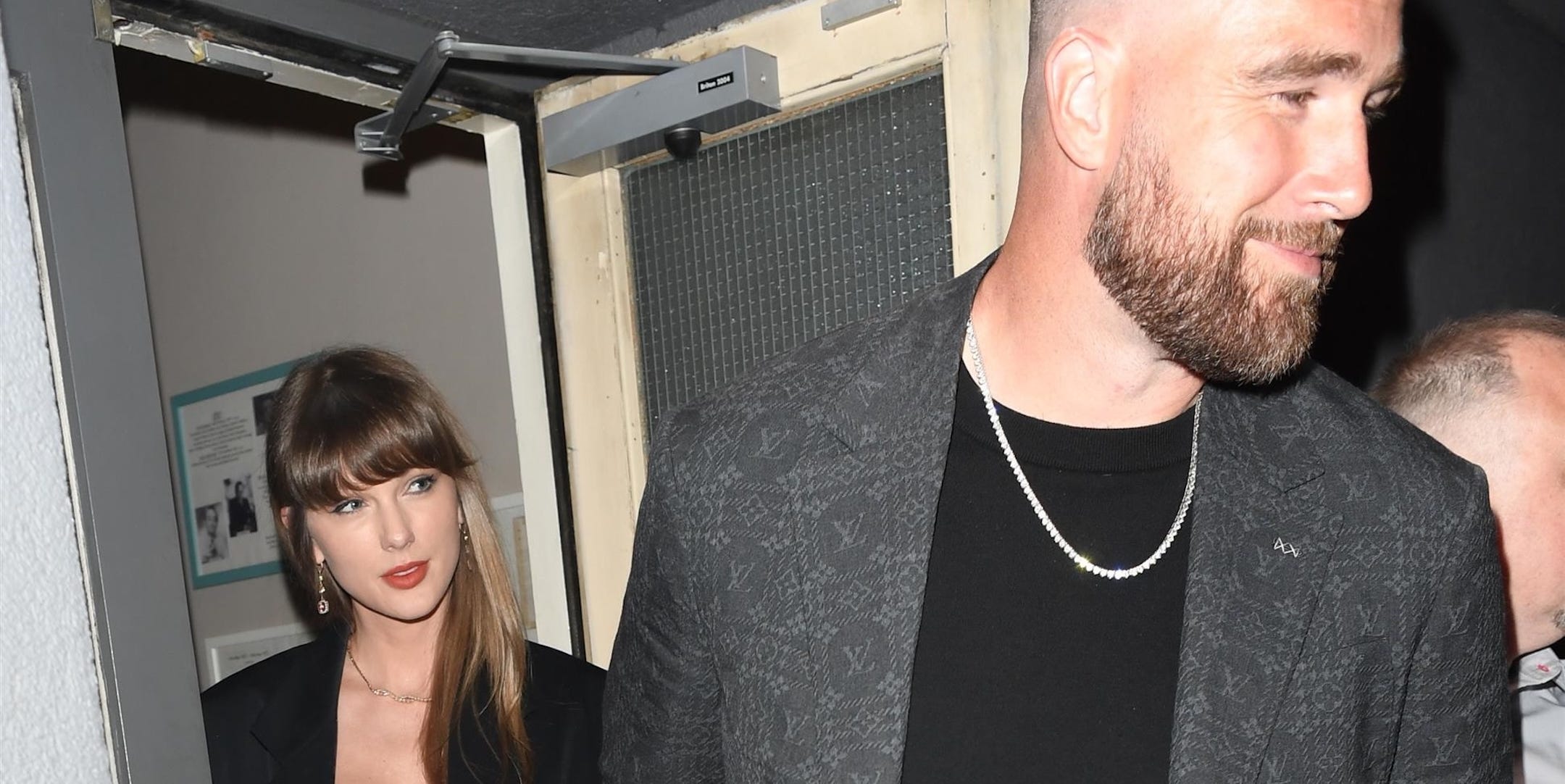 Taylor Swift’s black floral midi dress is perfect for a spring date night