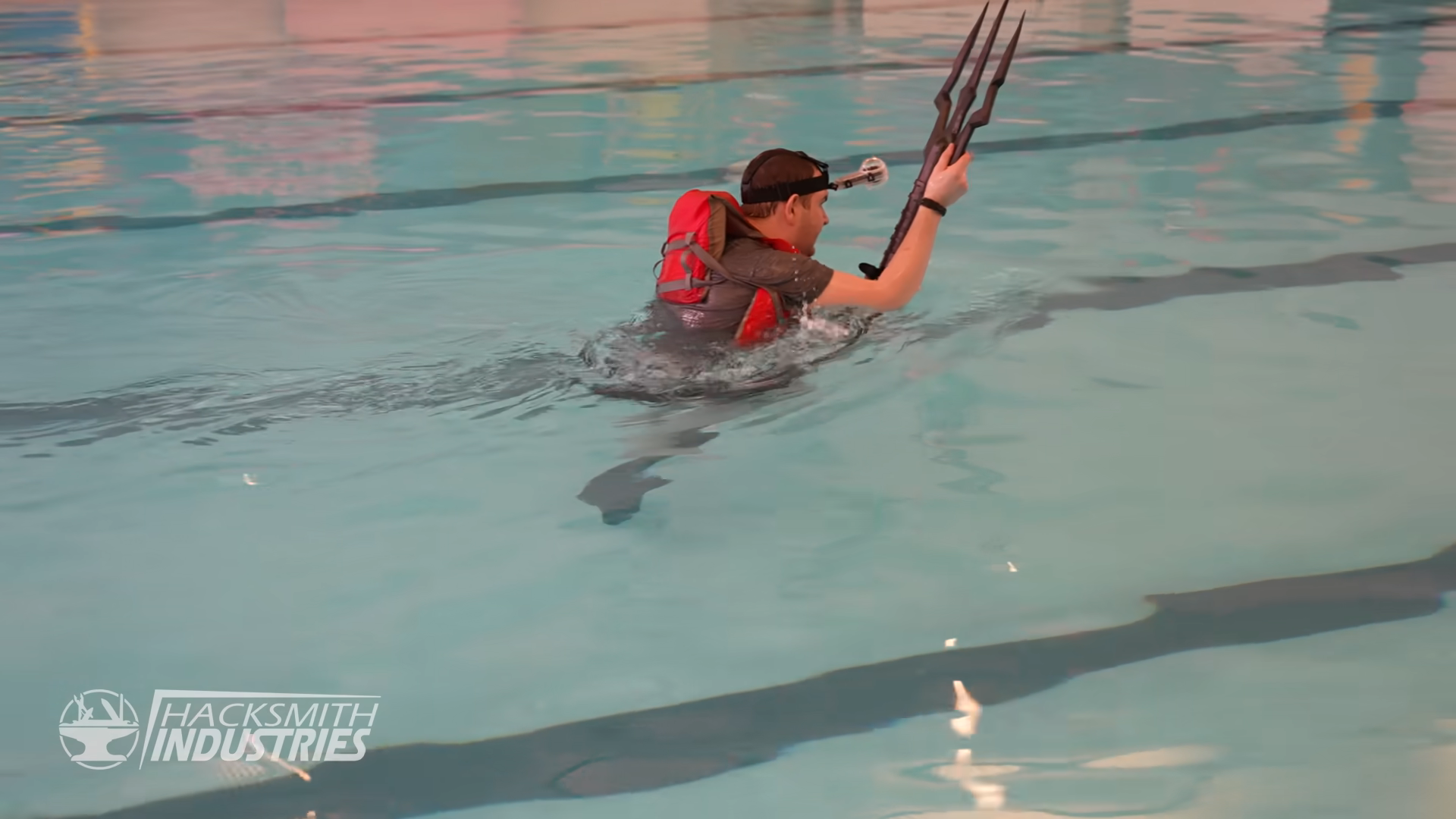 He tried swimming faster than Michael Phelps using a jet trident