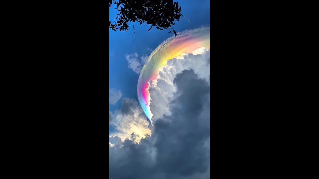 Rare iridescent clouds appear over Indonesia in spectacular rainbow display