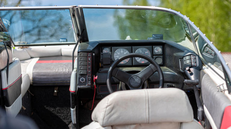 Why do most boats have steering wheels on the right side?