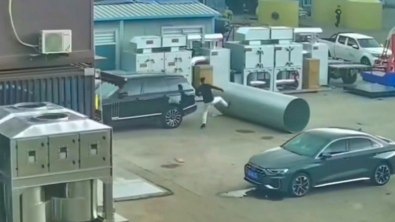Man rushes into danger as runaway steel roll heads for car