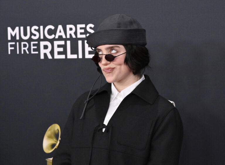 Billie Eilish wows fans in plunging black top as she flaunts results of ...